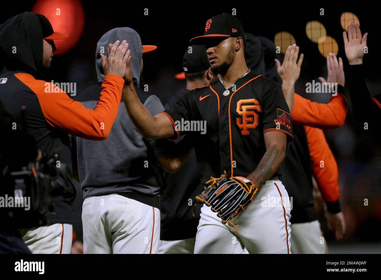 San Francisco Giants' Camilo Doval (75) is congratulated by teammates ...