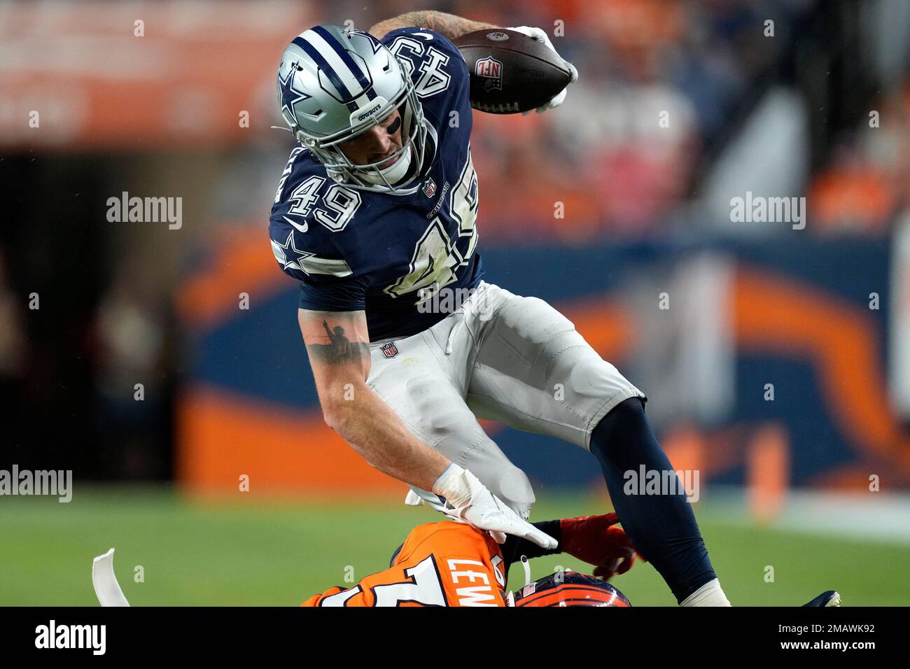 Dallas Cowboys tight end Peyton Hendershot (49) is hit by Denver ...