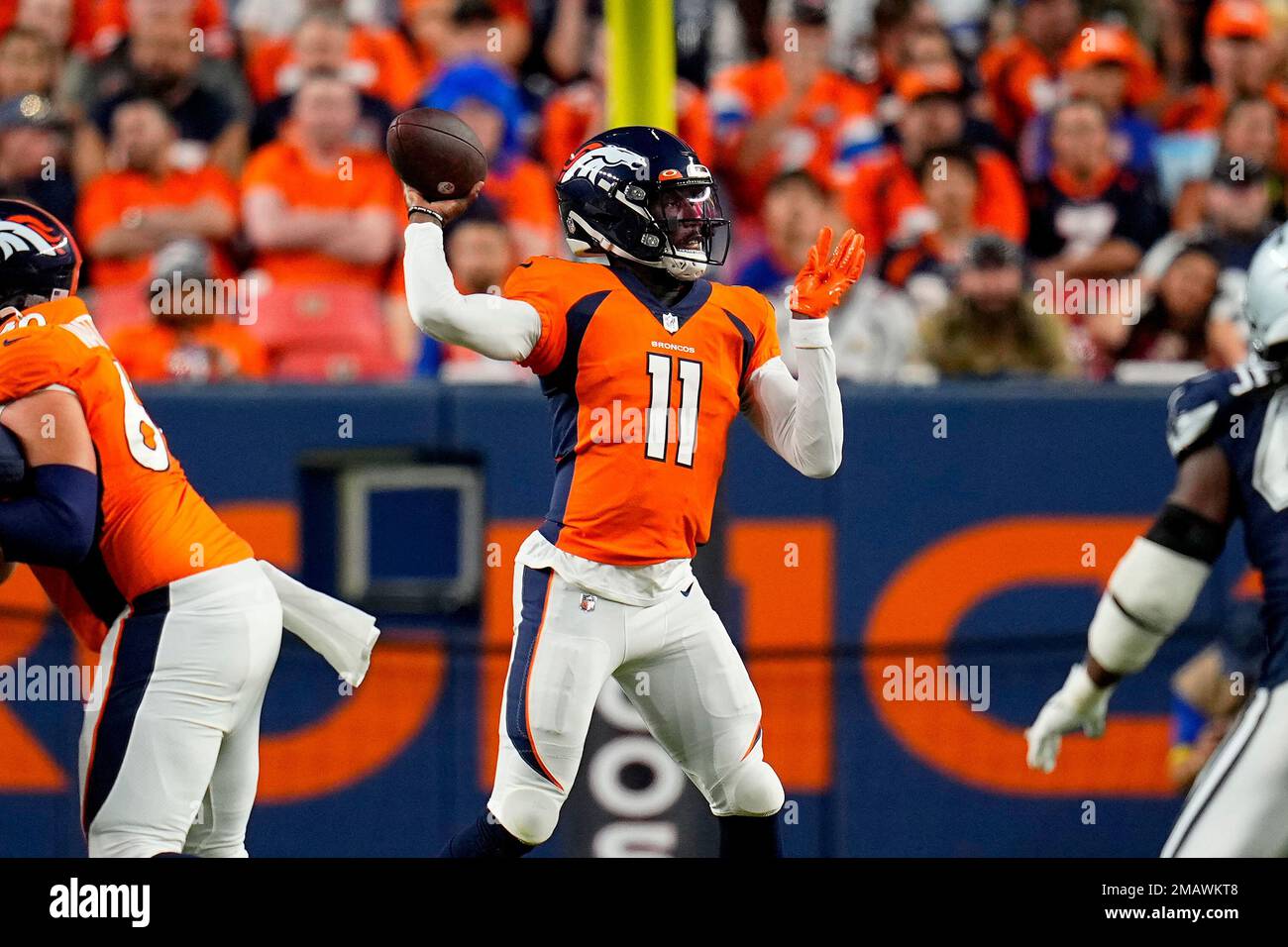 Denver Broncos quarterback Josh Johnson (11) throws against the Dallas ...