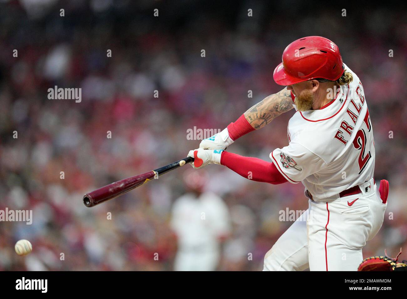 Cincinnati Reds' Jake Fraley (27) hits a single during the fifth inning ...