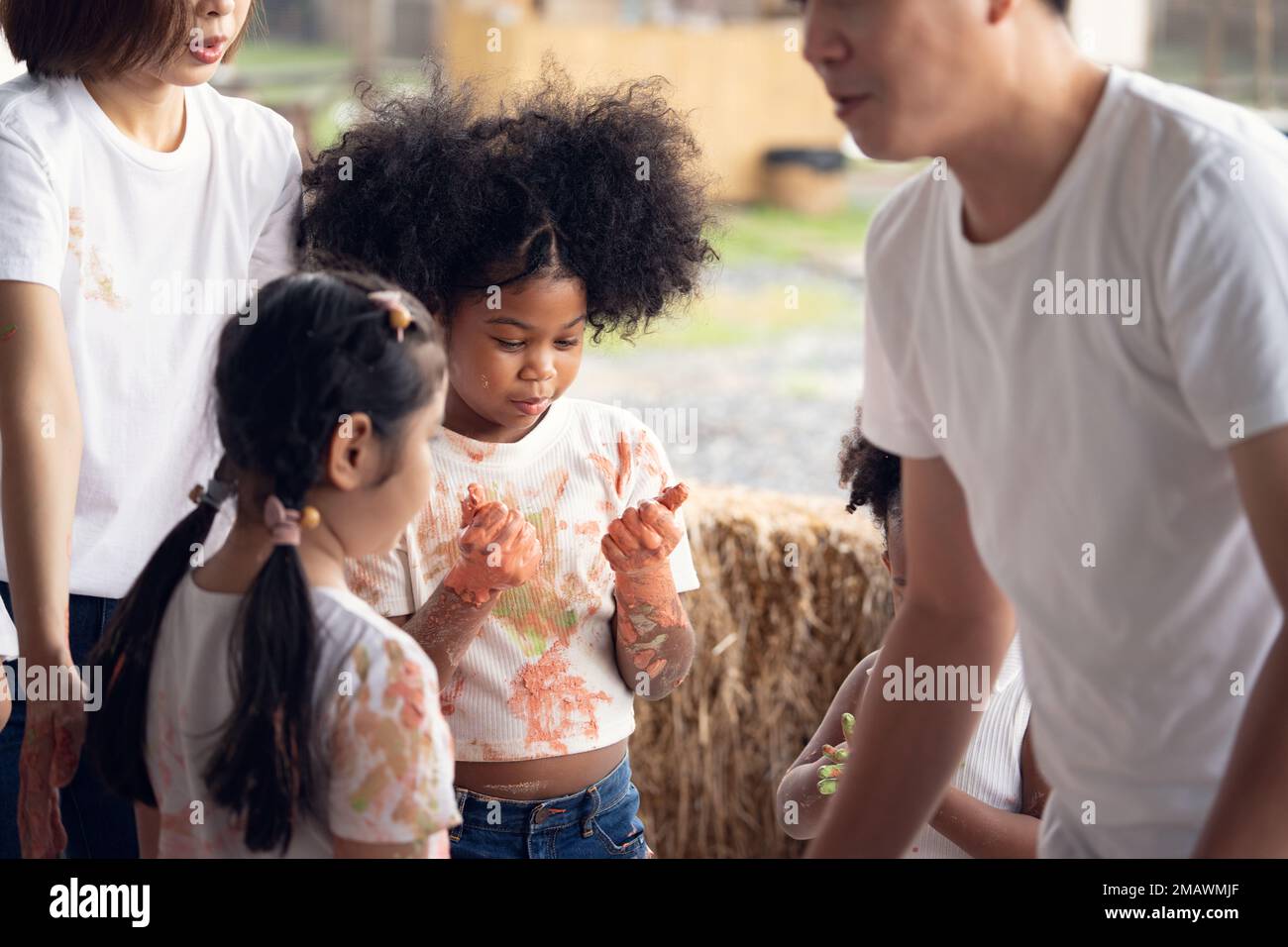 Group of children playing colourful water colours and colour stain on ...