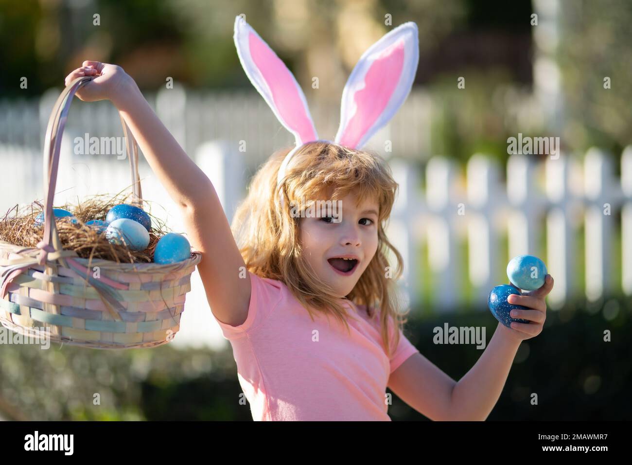 Child hunting easter eggs. Excited child with easter basket. Cute kid ...