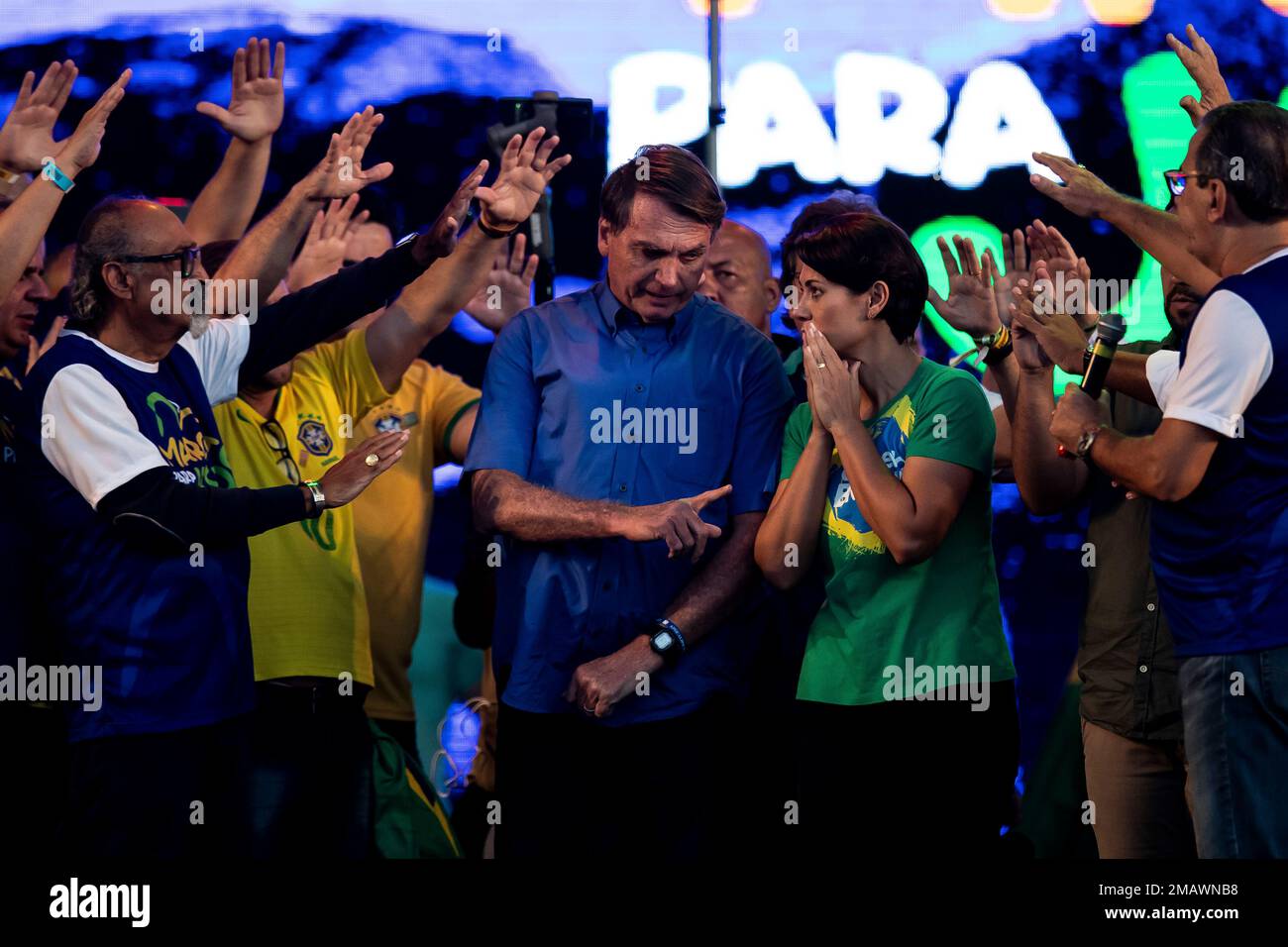 Brazil's President Jair Bolsonaro, center, and his wife, first lady ...