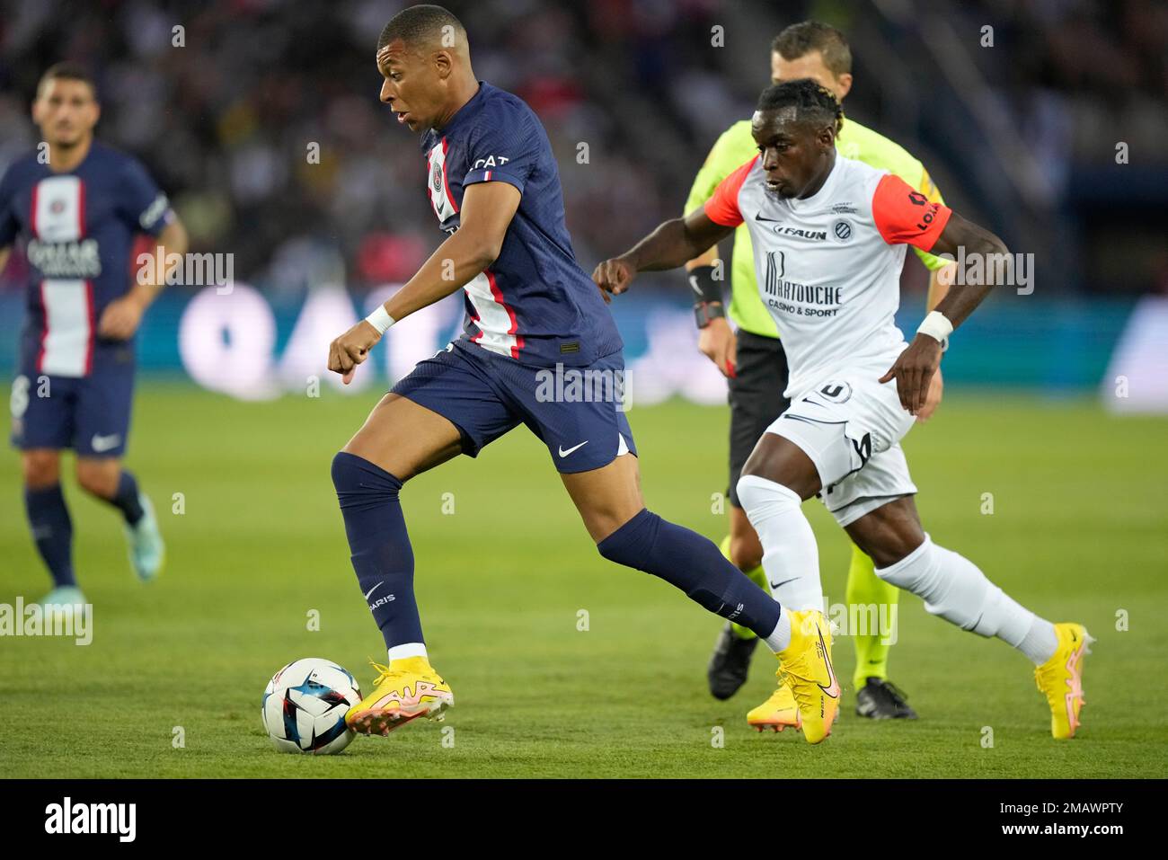 PSG's Kylian Mbappe runs with the ball during the French League One ...