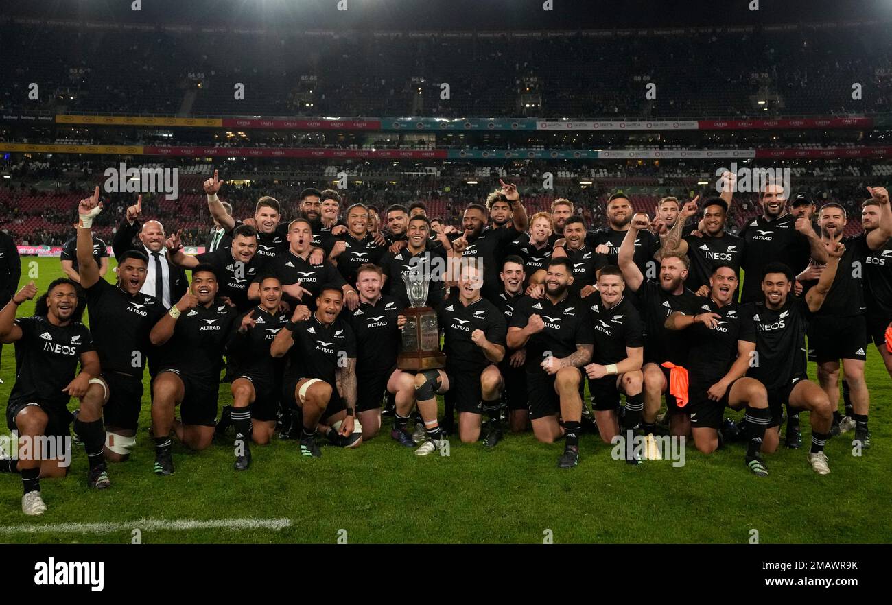 New Zealand's players pose with the trophy after the Rugby Championship ...