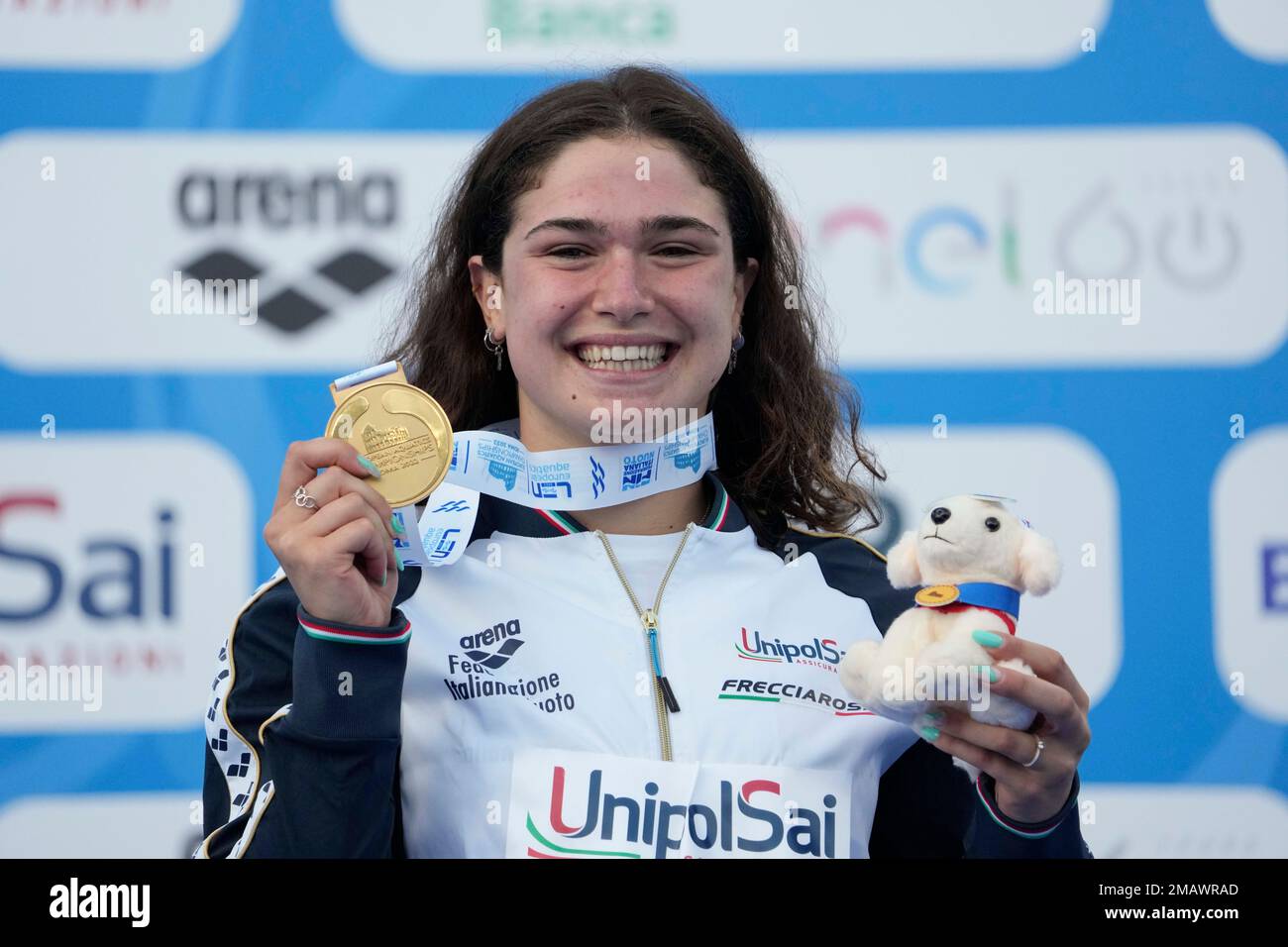 First placed Italy's Benedetta Pilato celebrates on the podium at the ...