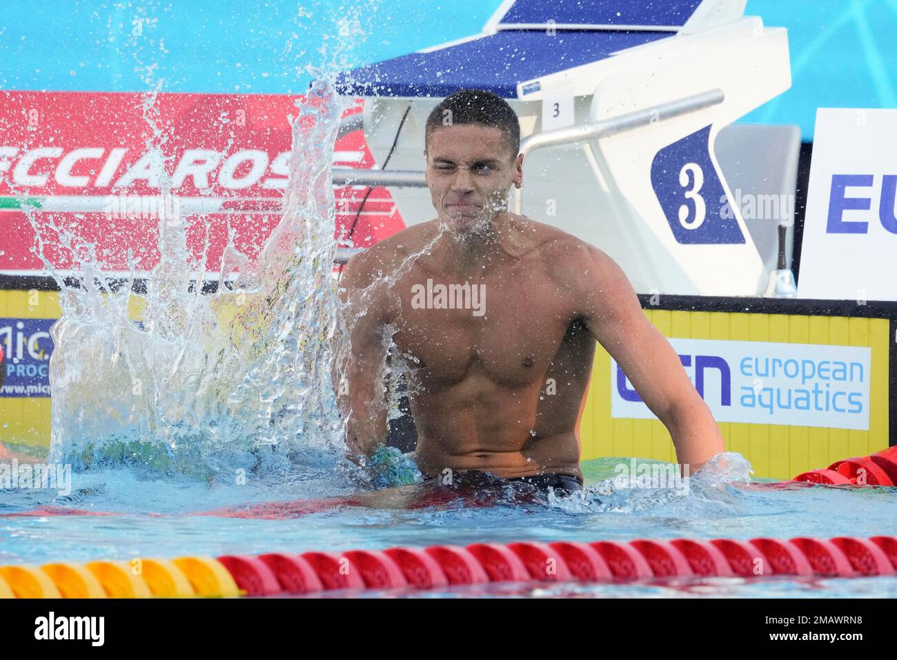 Romania's David Popovici celebrates after winning the men's 100m ...