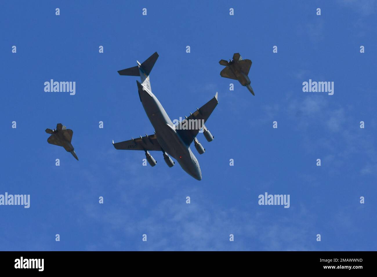 One C-17 and two F-22 aircraft from the U.S. Air Force 3rd Wing fly ...