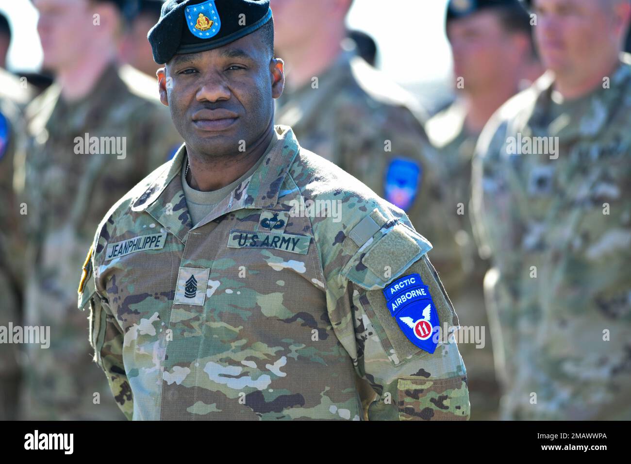 Command Sgt. Maj. Max Jeanphilippe proudly displays the shoulder patch of the newly activated ...