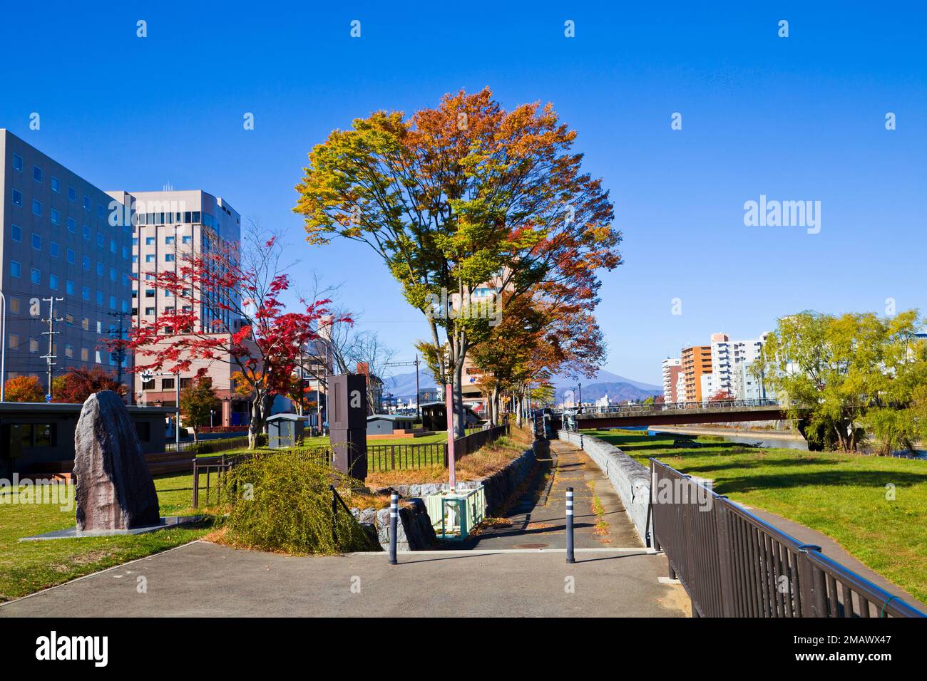 Mount Iwate scene with buildings and promenade at Katakami river in ...