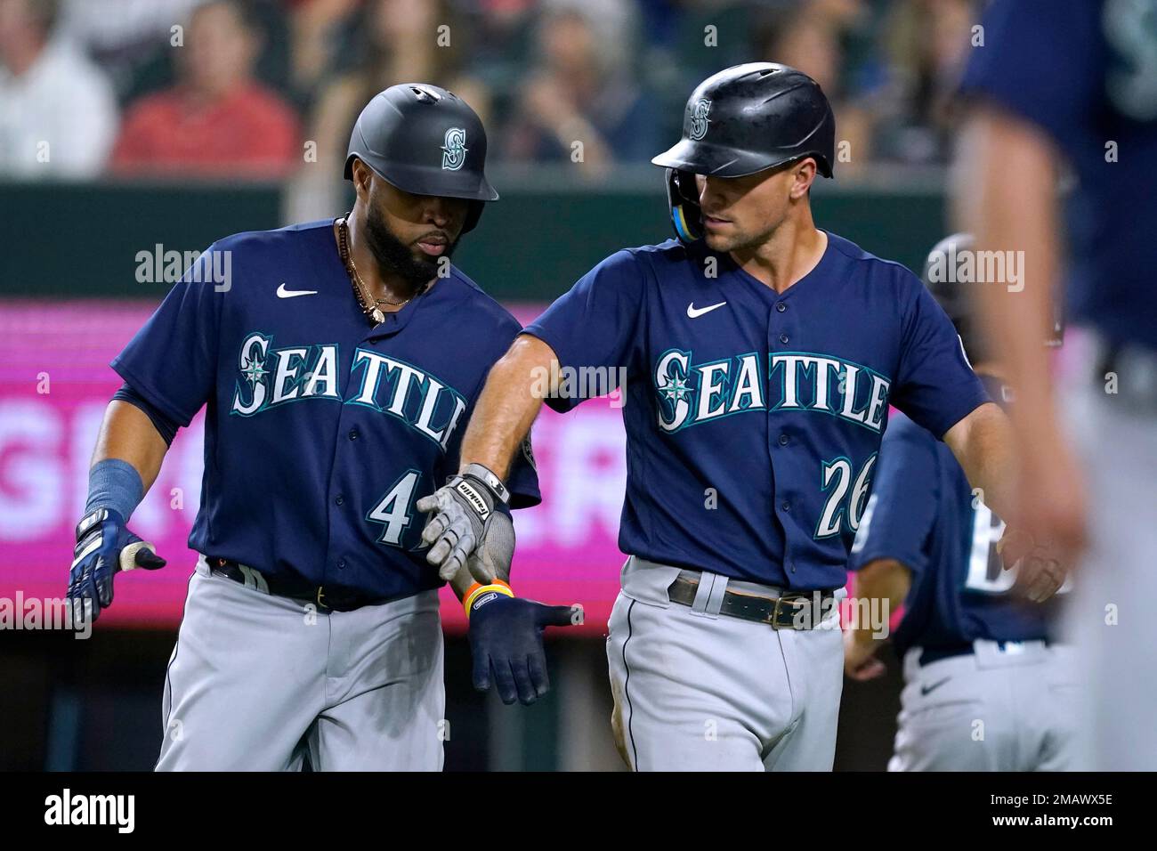 Seattle Mariners' Carlos Santana, left, and Adam Frazier celebrate ...