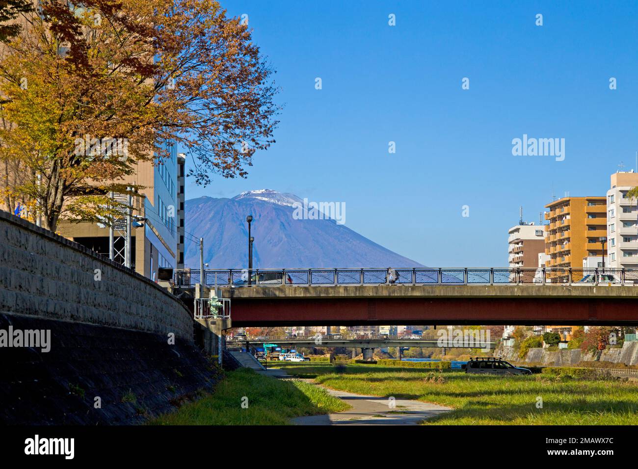Mount Iwate scene with buildings and promenade at Katakami river in ...