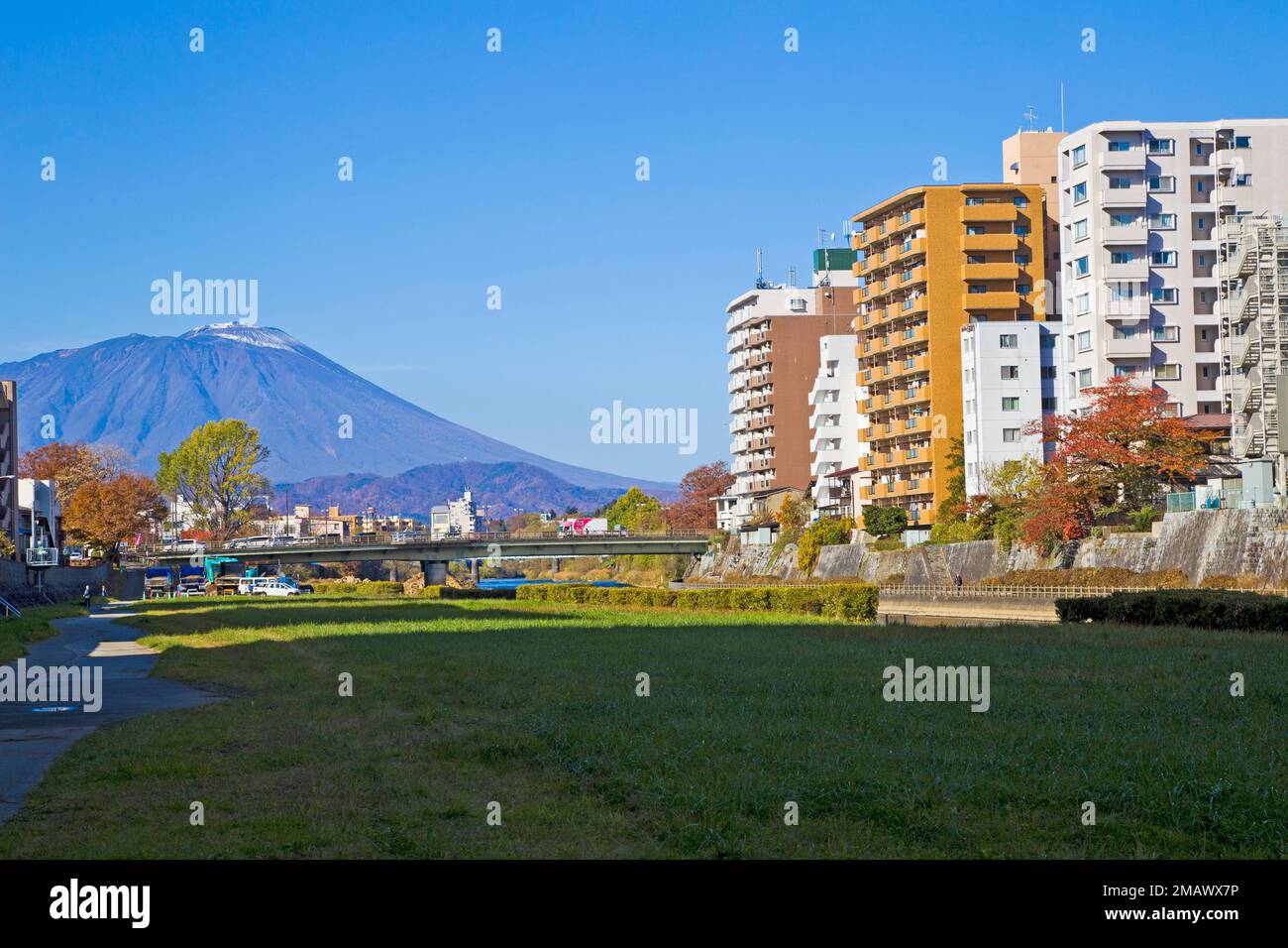 Mount Iwate scene with buildings and promenade at Katakami river in ...