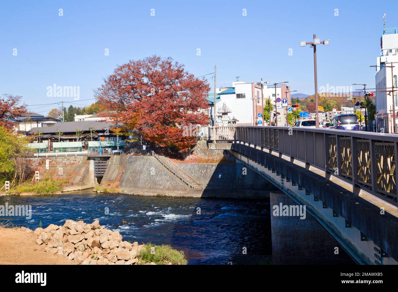 Mount Iwate scene with buildings and promenade at Katakami river in ...