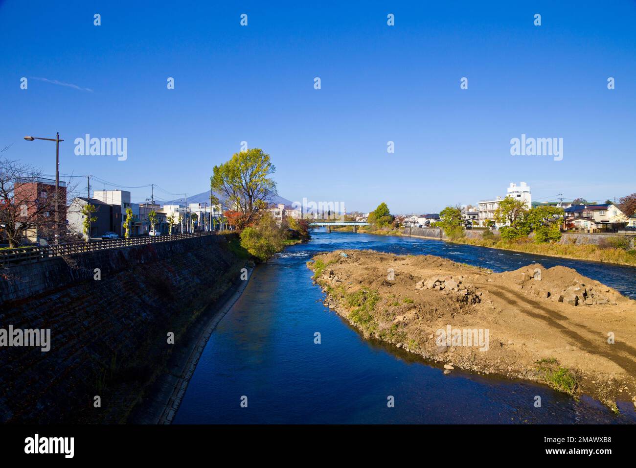 Mount Iwate scene with buildings and promenade at Katakami river in ...