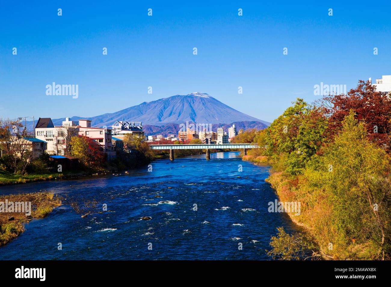 Mount Iwate scene with buildings and promenade at Katakami river in Morioka city, Iwate ...