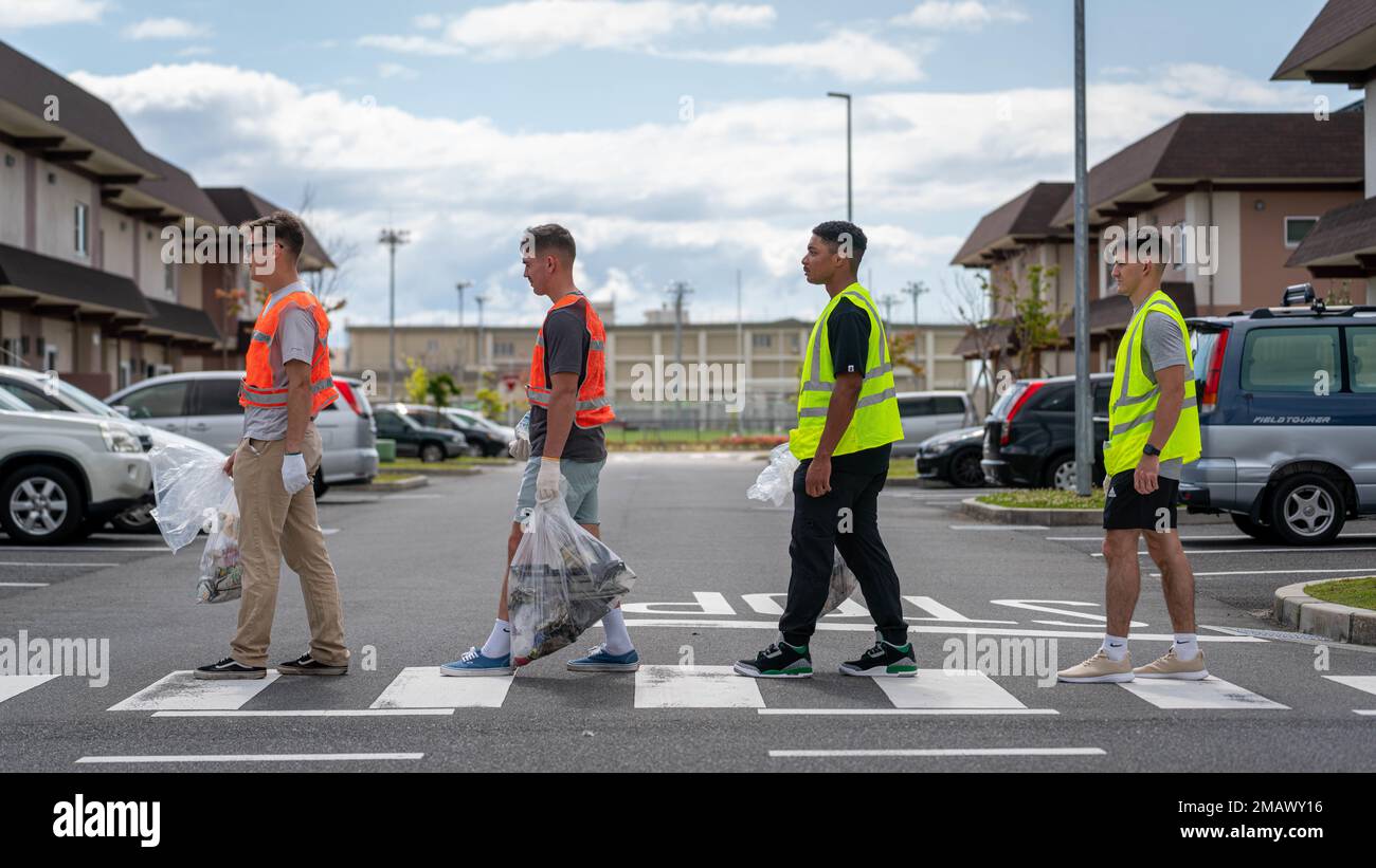 U.S. Marines pose for a photo during an on-base cleanup organized by ...