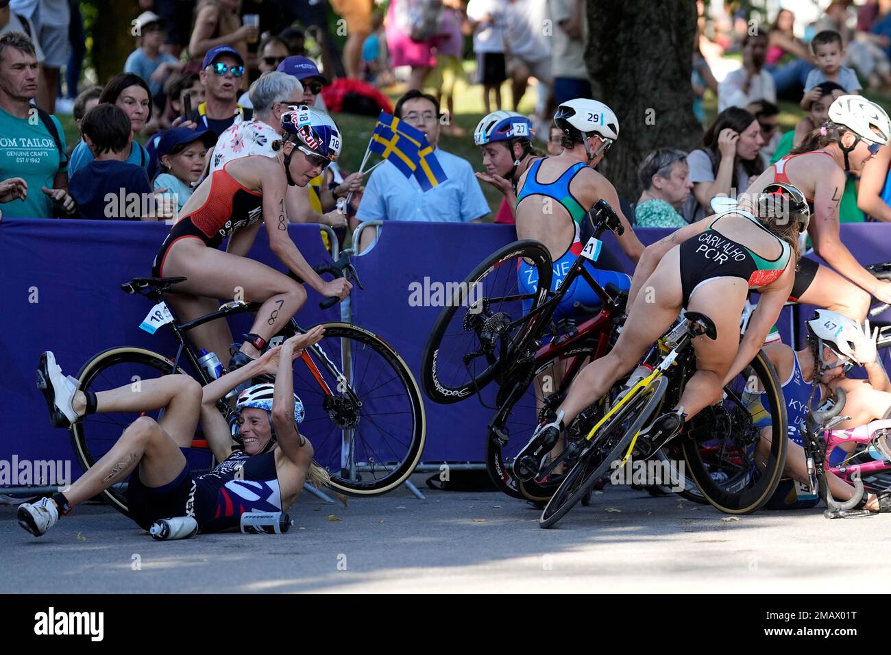 Athletes crash on bicycles during the women's Triathlon event at the ...