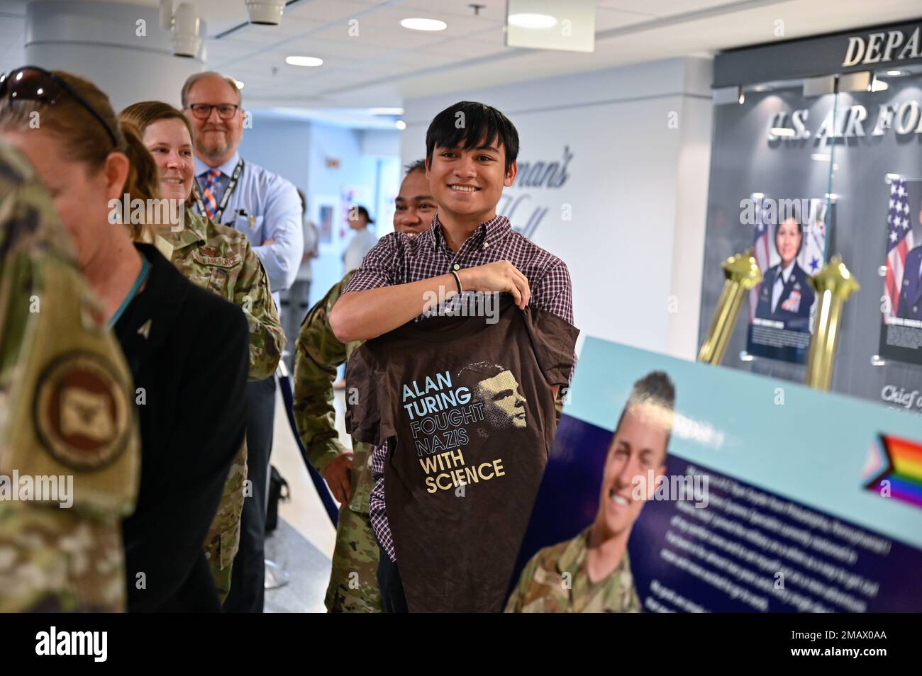 A guest displays a t-shirt during a Department of the Air Force Pride ...