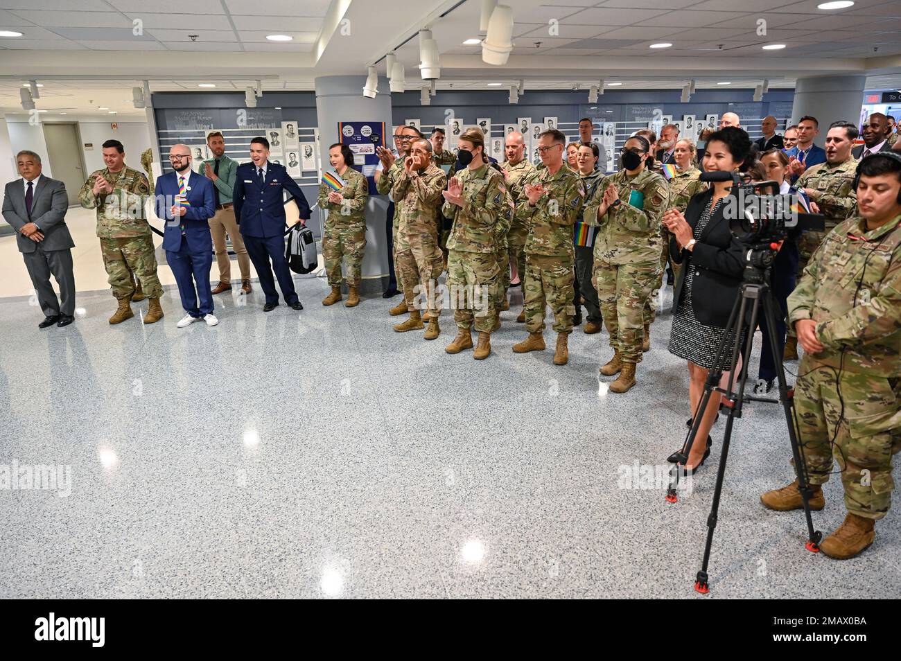Guests cheer during a Department of the Air Force Pride celebration at ...