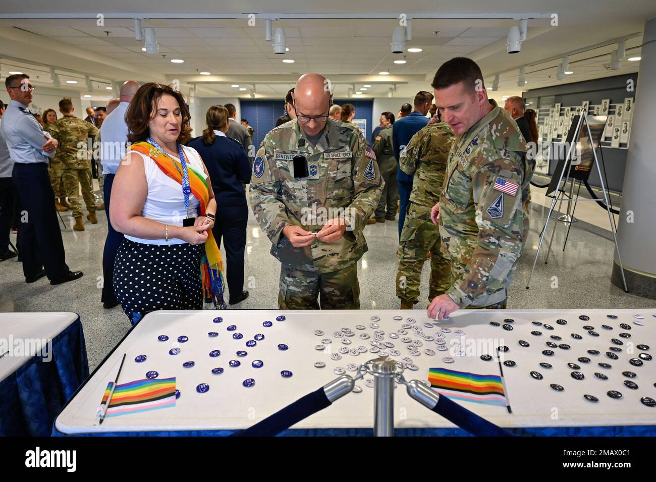 Guests look at pins during a Department of the Air Force Pride ...