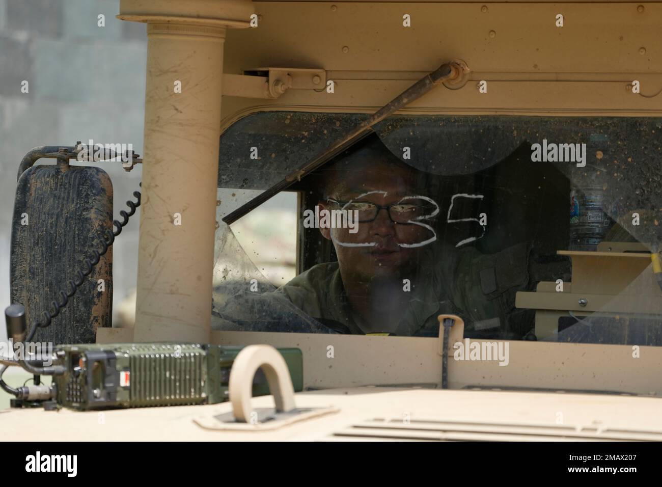 A U.S. soldier sits inside a Humvee during Super Garuda Shield 2022 ...