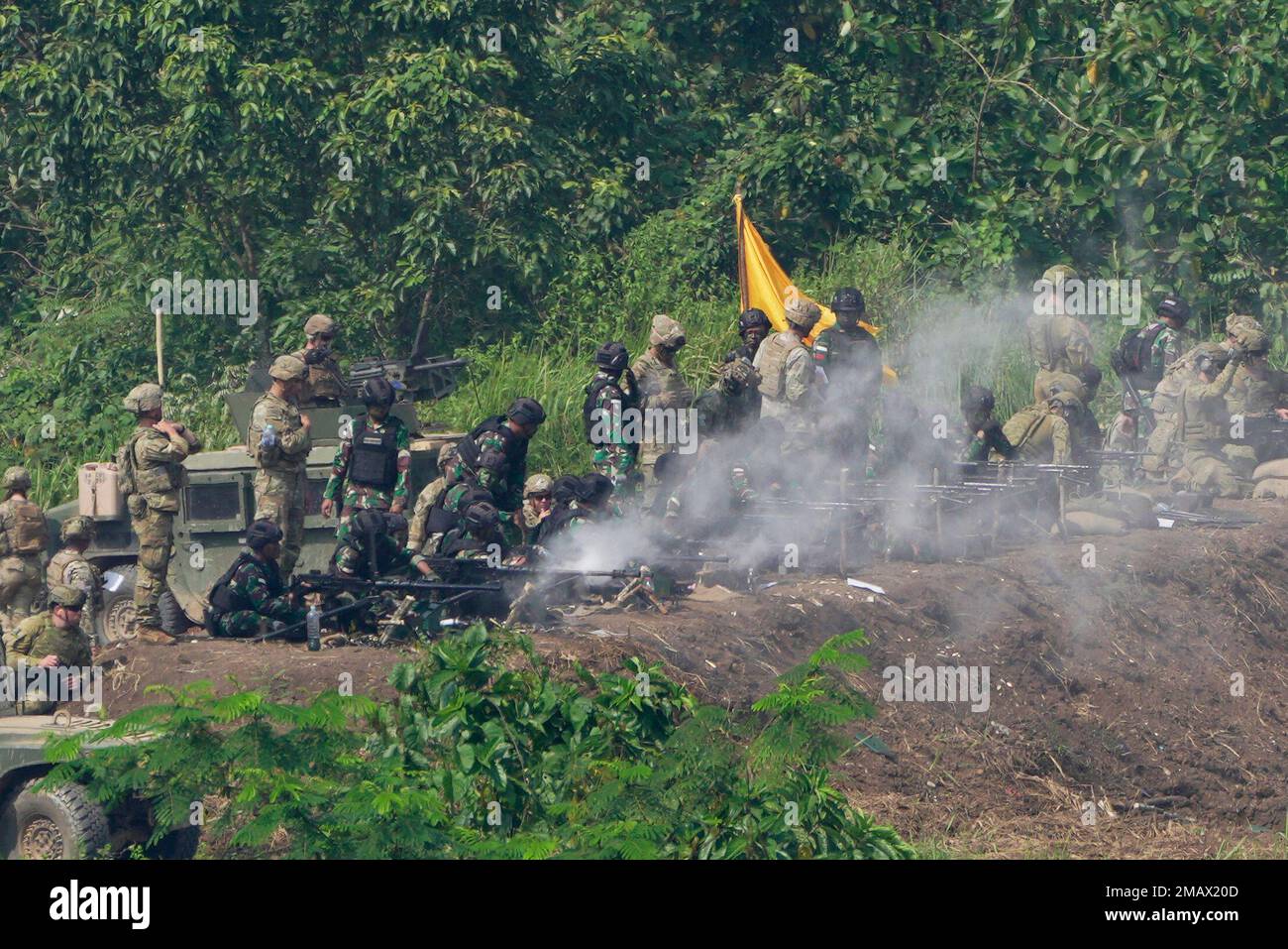 U.S. and Indonesian soldiers engage targets with their heavy machine ...