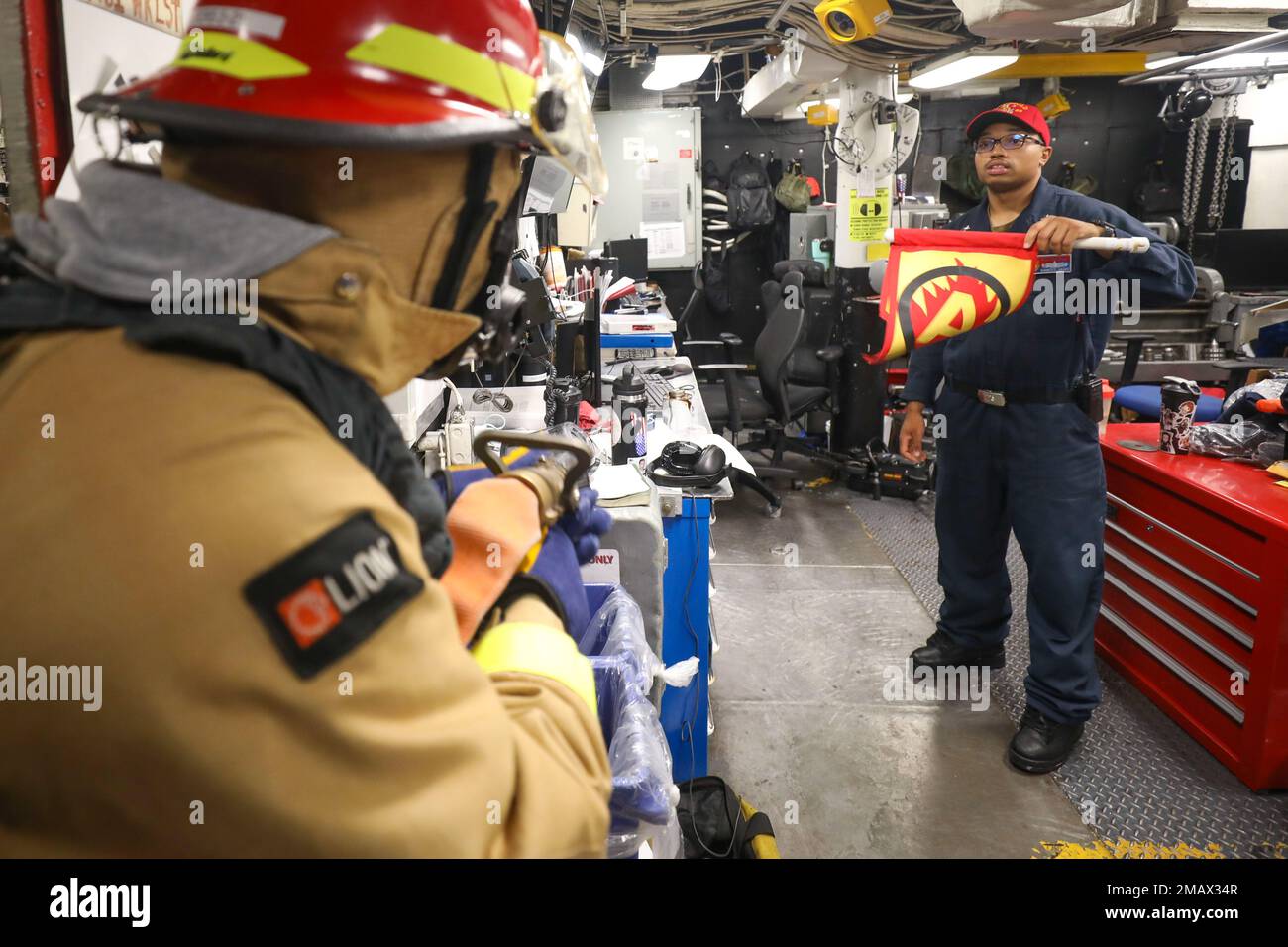 PHILIPPINE SEA (June 6, 2022) Fireman Alexander Mena (left), from ...