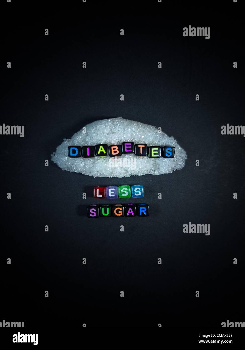 Black bead with color letter in word DIABETES LESS SUGAR with sugar and ...