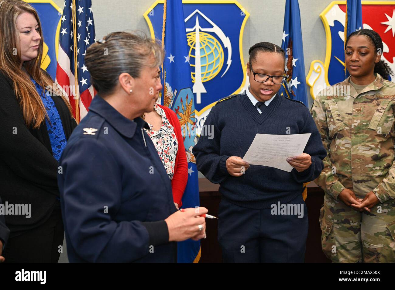 Col. Katrina Stephens, installation commander, looks on as Staff Sgt ...