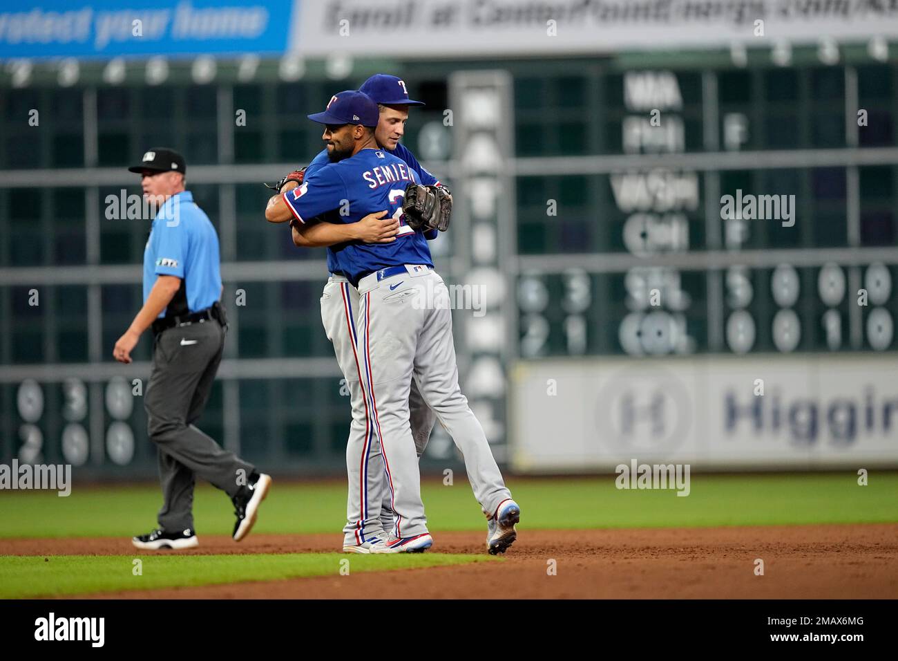 Texas Rangers' Marcus Semien (2) and Corey Seager hug after a baseball ...