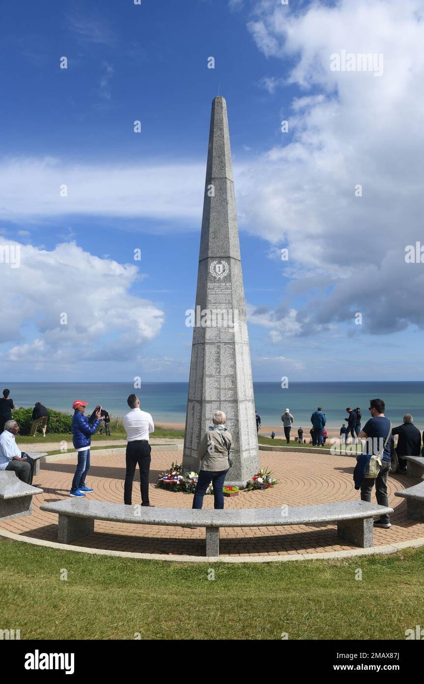 An obelisk on the bluff above Omaha beach is inscribed with the symbol ...