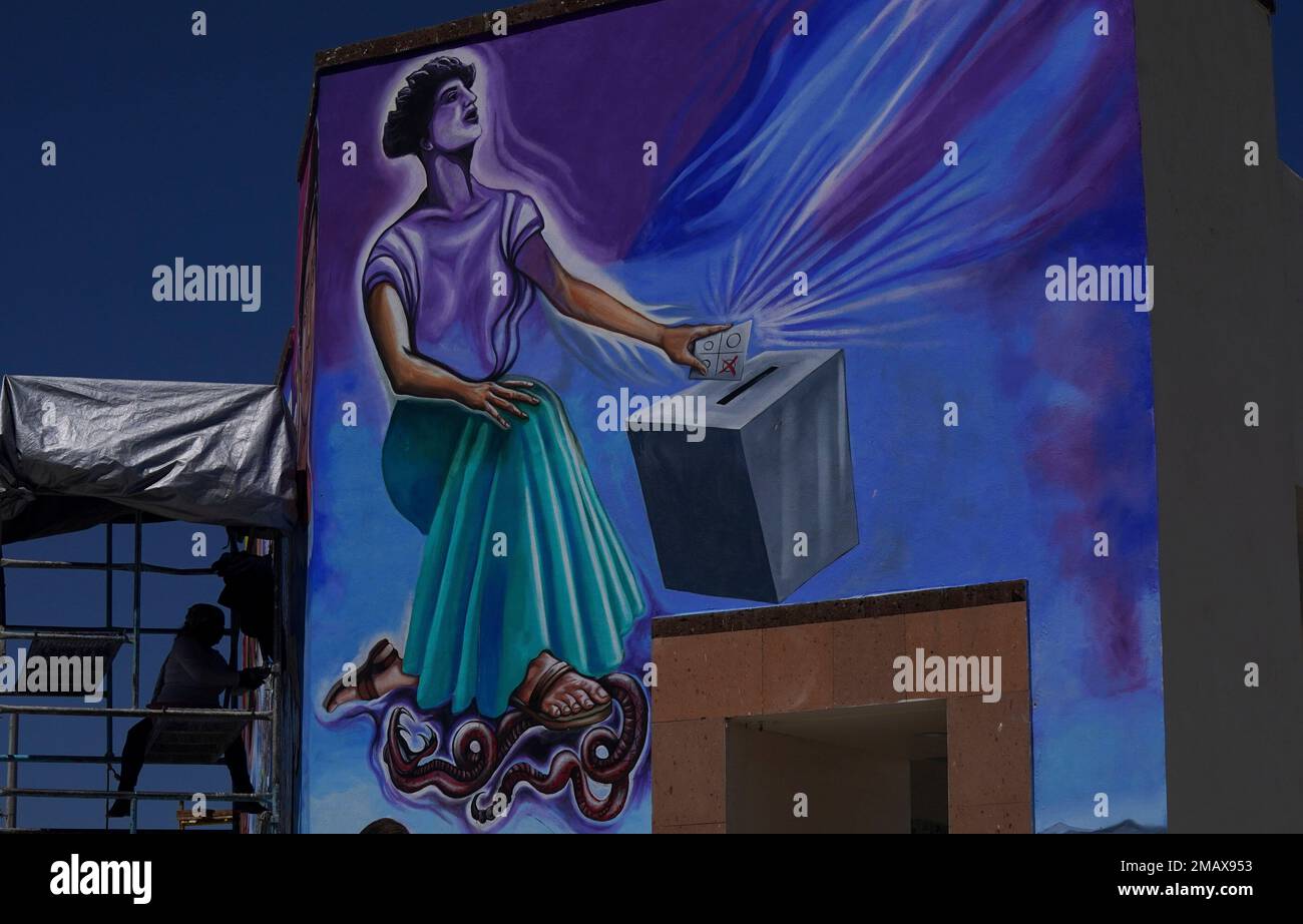 Mexican mural artist Janet Calderon paints a mural in San Salvador ...