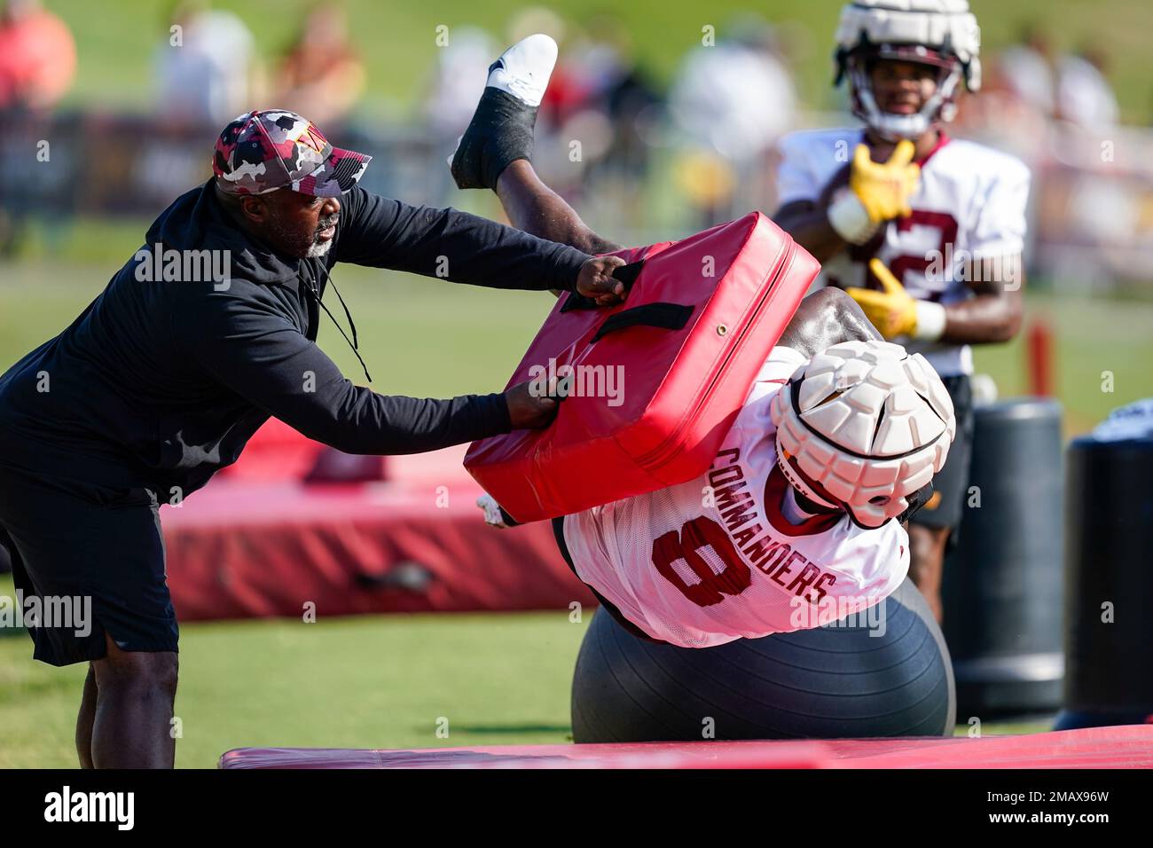 Washington Commanders running back Brian Robinson (8) dives during a ...
