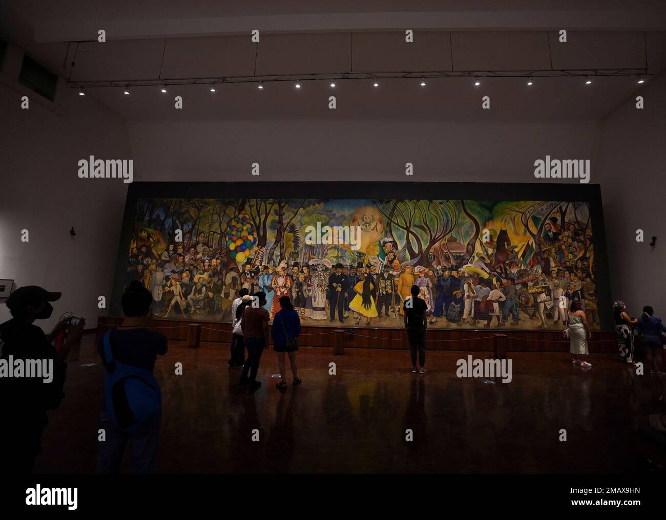 Visitors look at the “Dream of a Sunday afternoon in Alameda Central ...