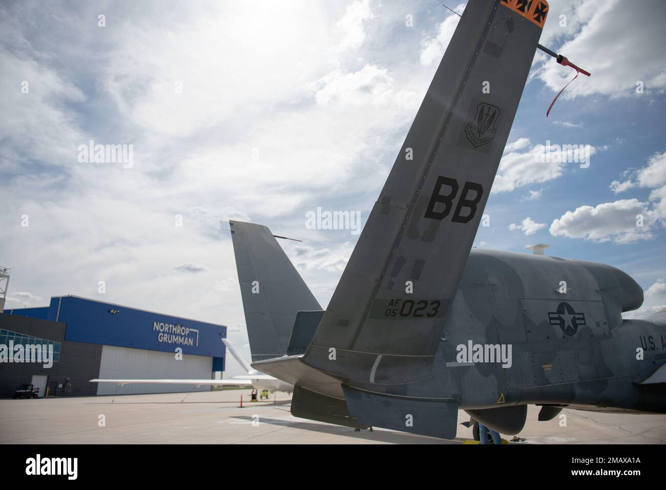 An RQ-4 Block 30 Global Hawk remotely piloted aircraft sits outside the Northrop Grumman hangar ...