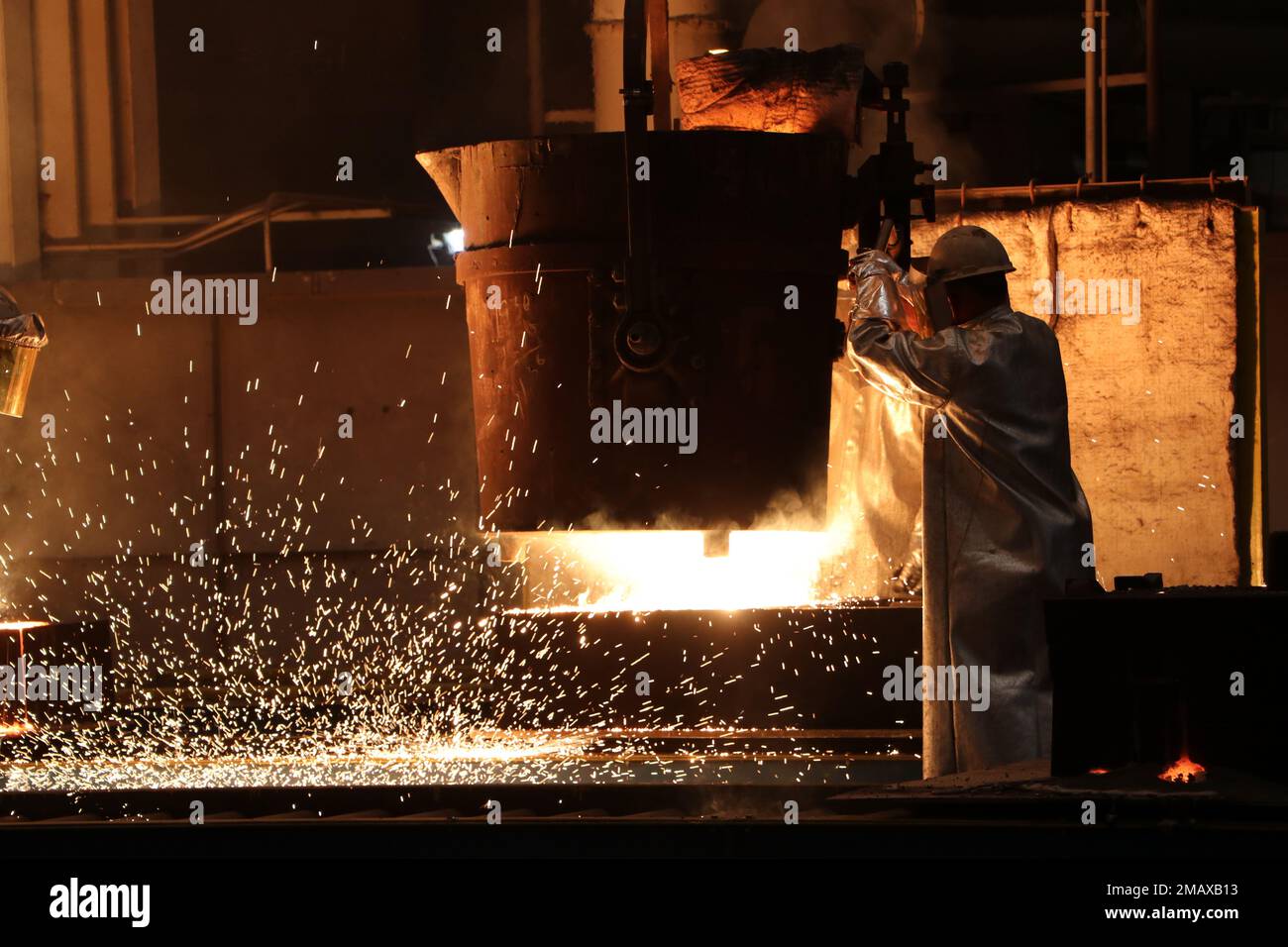 A Rock Island Arsenal-Joint Manufacturing and Technology Center artisan transports 3000-degree ...