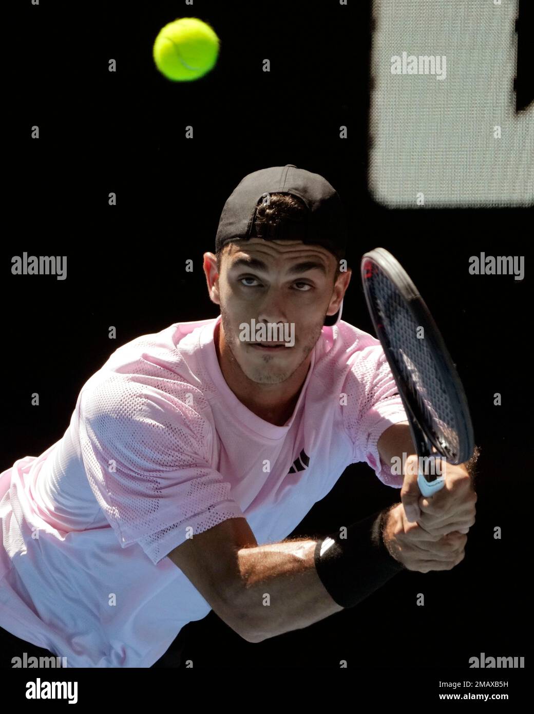 Francisco Cerundolo of Argentina plays a backhand return to Felix Auger-Aliassime of Canada ...