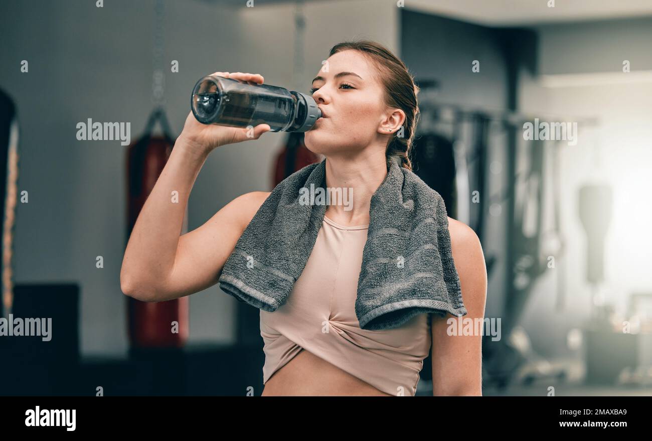 Exercise health, gym and woman drinking water for sports thirst ...