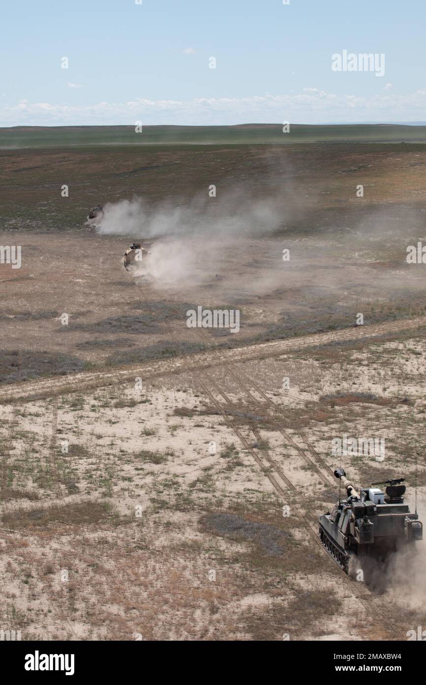 Two M109 Paladin artillery and a M992 Field Artillery Ammunition ...