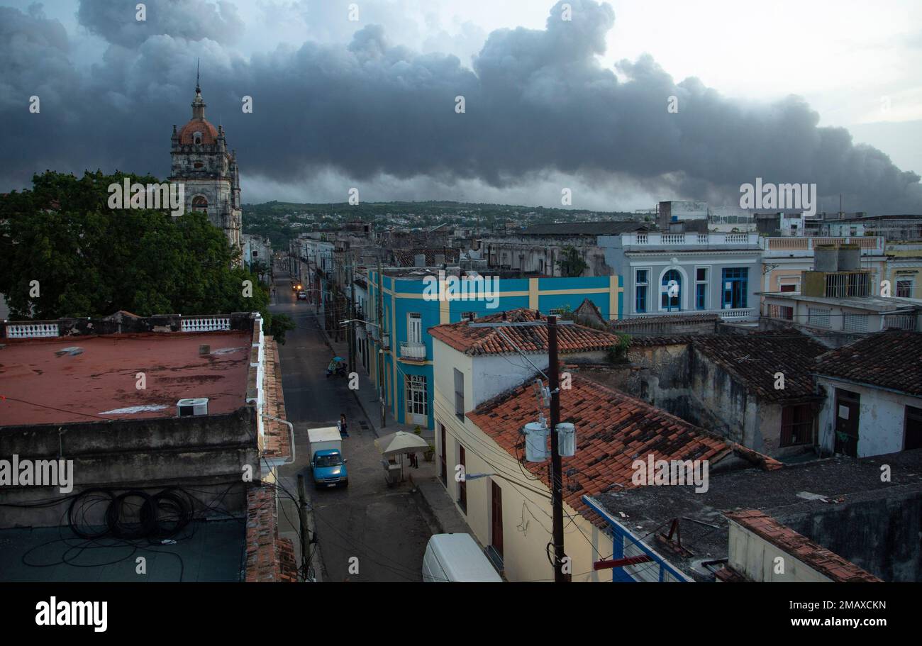 Smoke rises from a deadly fire at a large oil storage facility in ...