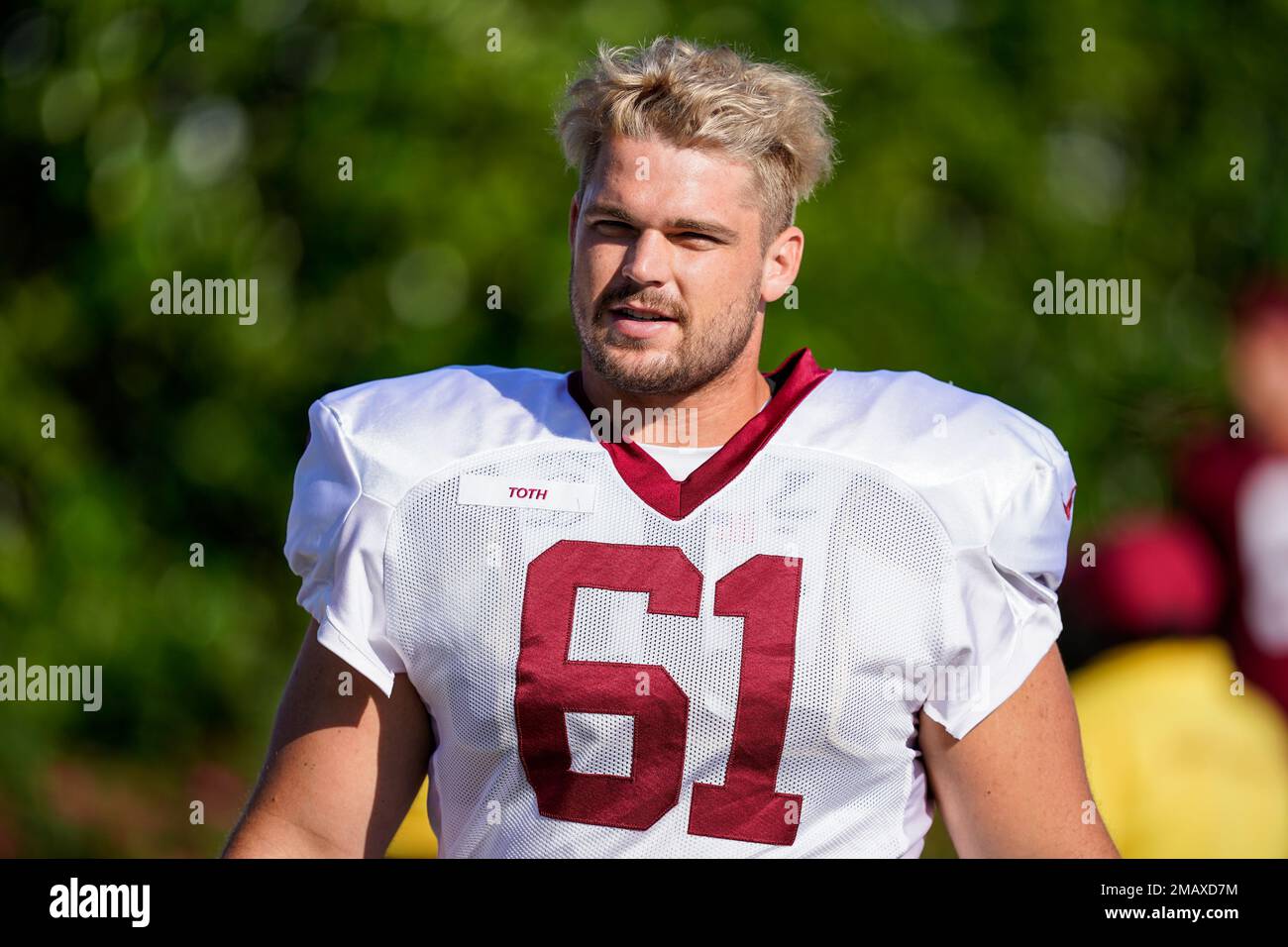 Washington Commanders center Jon Toth (61) arrives for practice at the ...