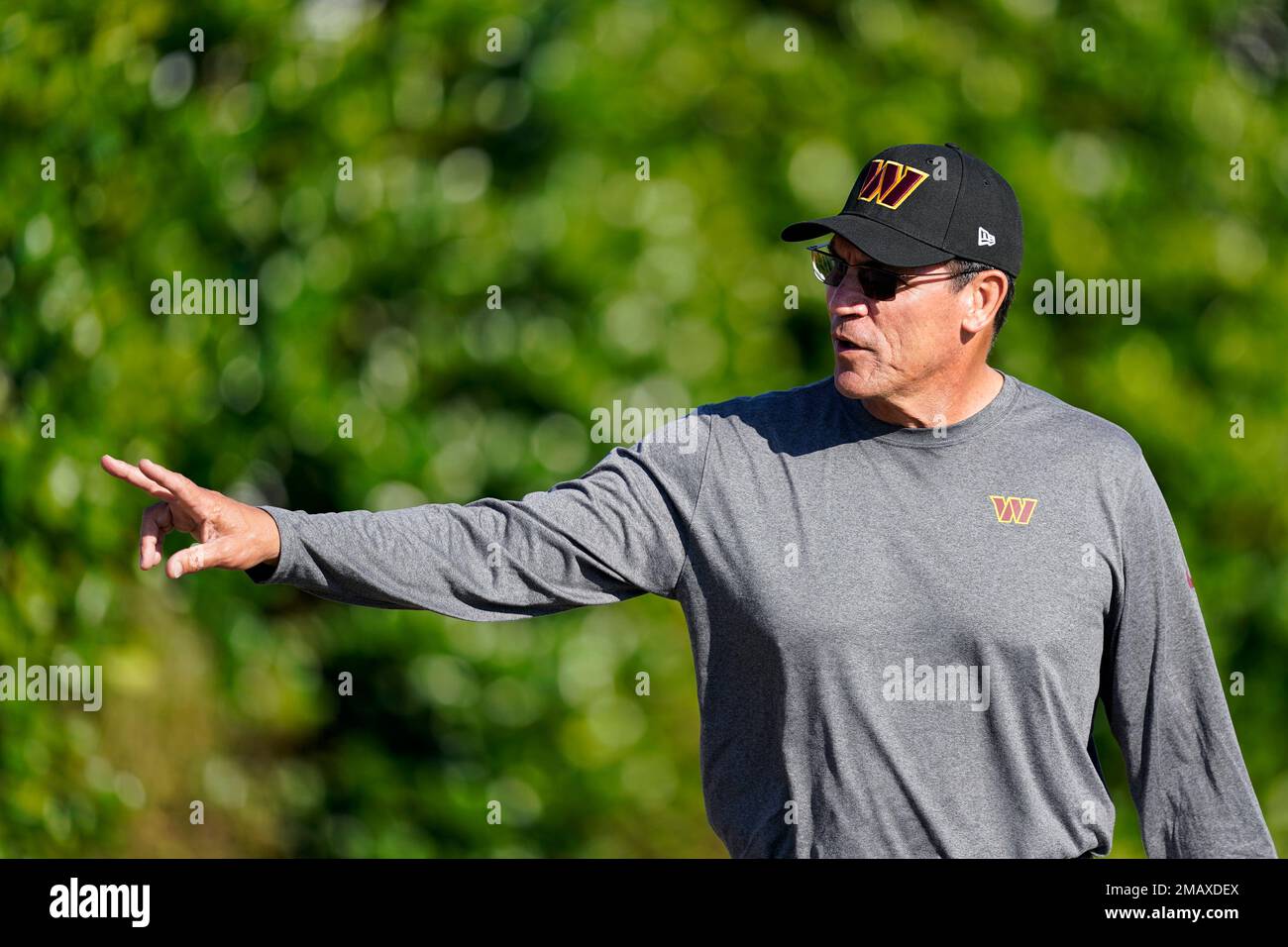 Washington Commanders head coach Ron Rivera waves to fans as he arrives ...