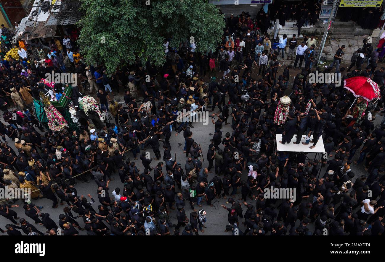 Shiite Muslims participate in a procession to mark Ashoura in Hyderabad ...