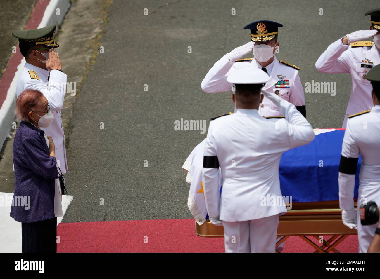 Widow and former first lady Amelita Ramos, left, with military chief ...
