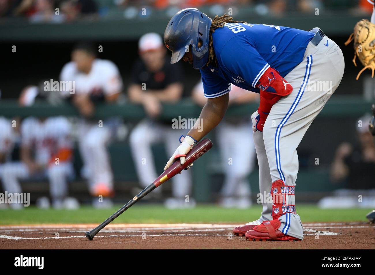 Toronto Blue Jays' Vladimir Guerrero Jr. draws in the sand with his bat ...