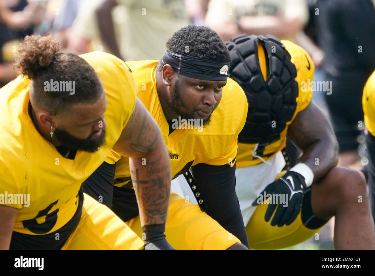 Pittsburgh Steelers linebacker Ron'Dell Carter, center, stretches with ...
