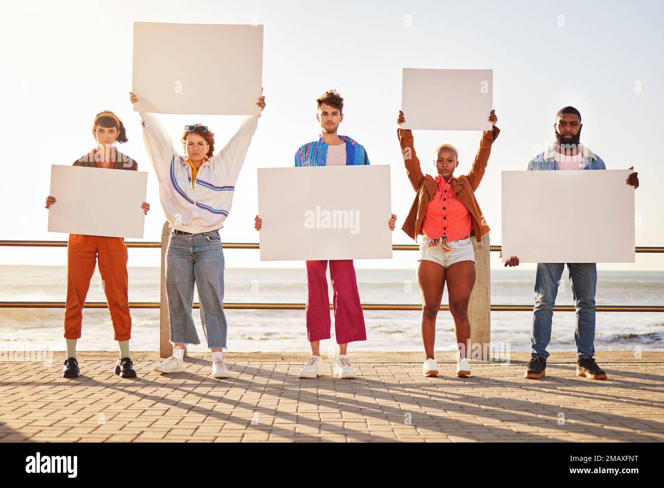 Portrait, poster and diversity with friends together holding signage in ...