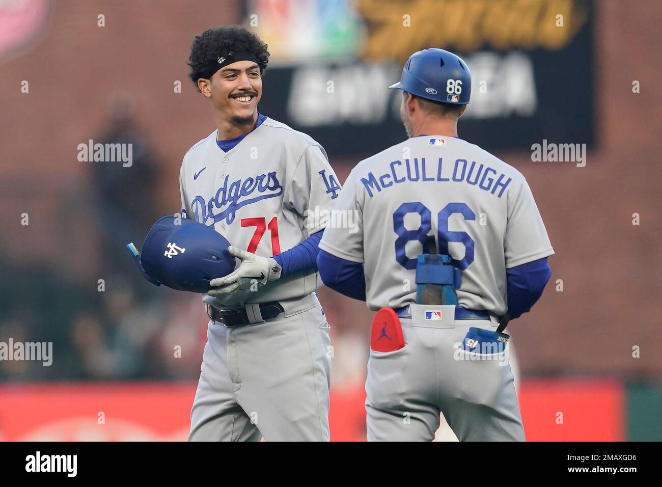 Los Angeles Dodgers' Miguel Vargas, left, is congratulated by first ...