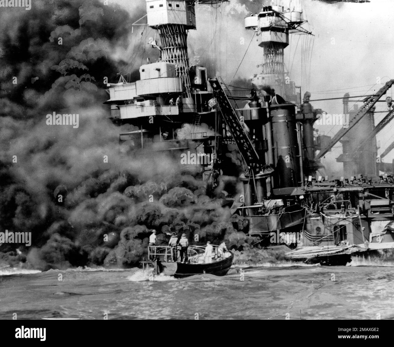 FILE - As heavy smoke rolls out of the stricken USS West Virginia, a ...